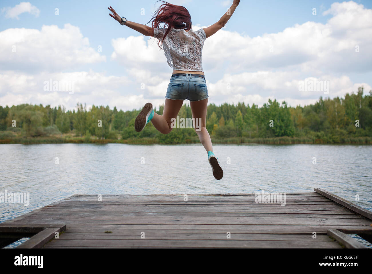 Woman jumping from bridge hi-res stock photography and images - Alamy
