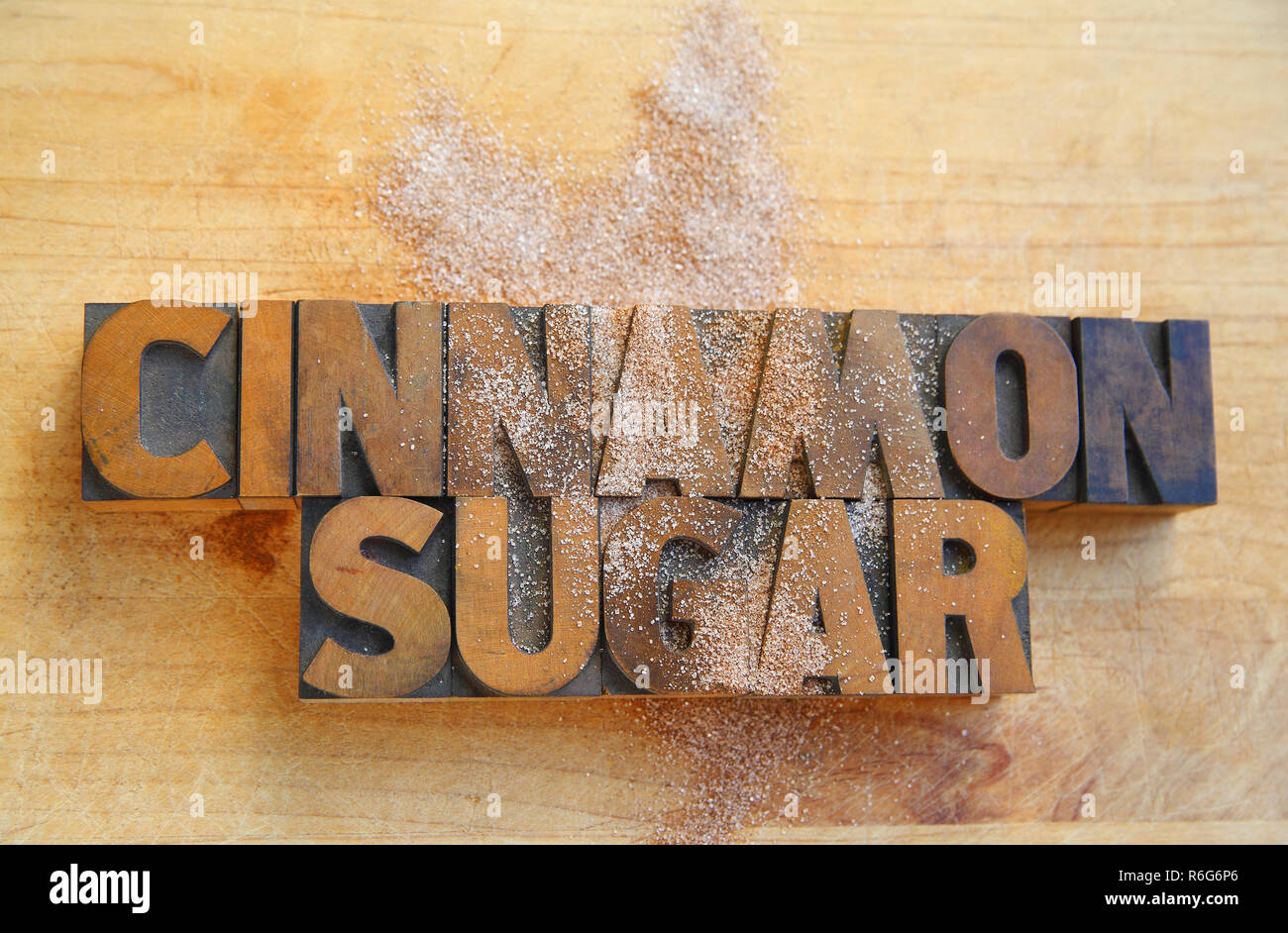 Cinnamon sugar words on cutting board Stock Photo - Alamy