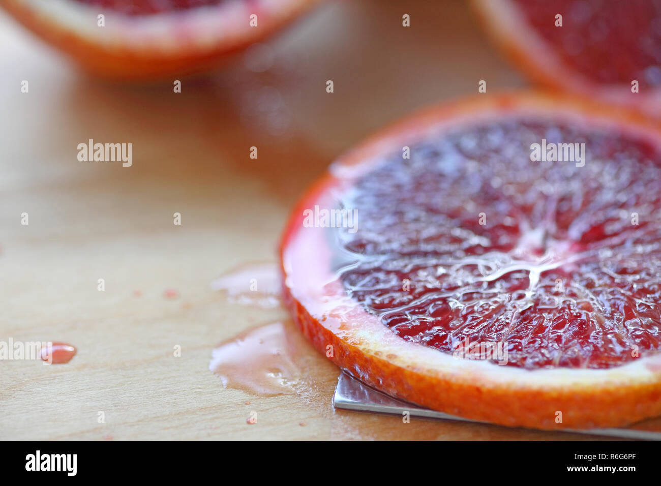 Juicy blood orange slice Stock Photo - Alamy