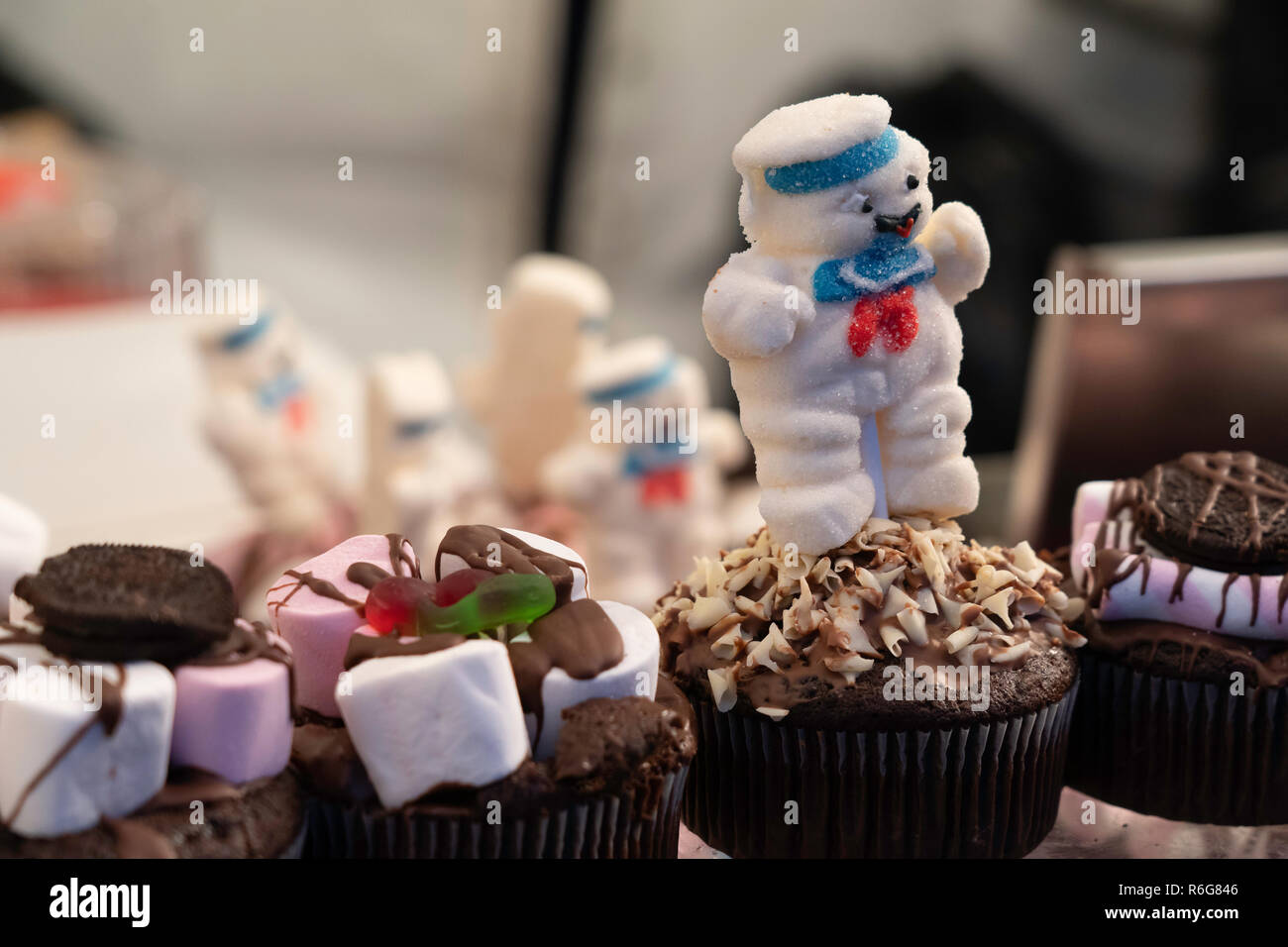 Appetising chocolate cupcake with sugary Snowman on top at a Christmas ...