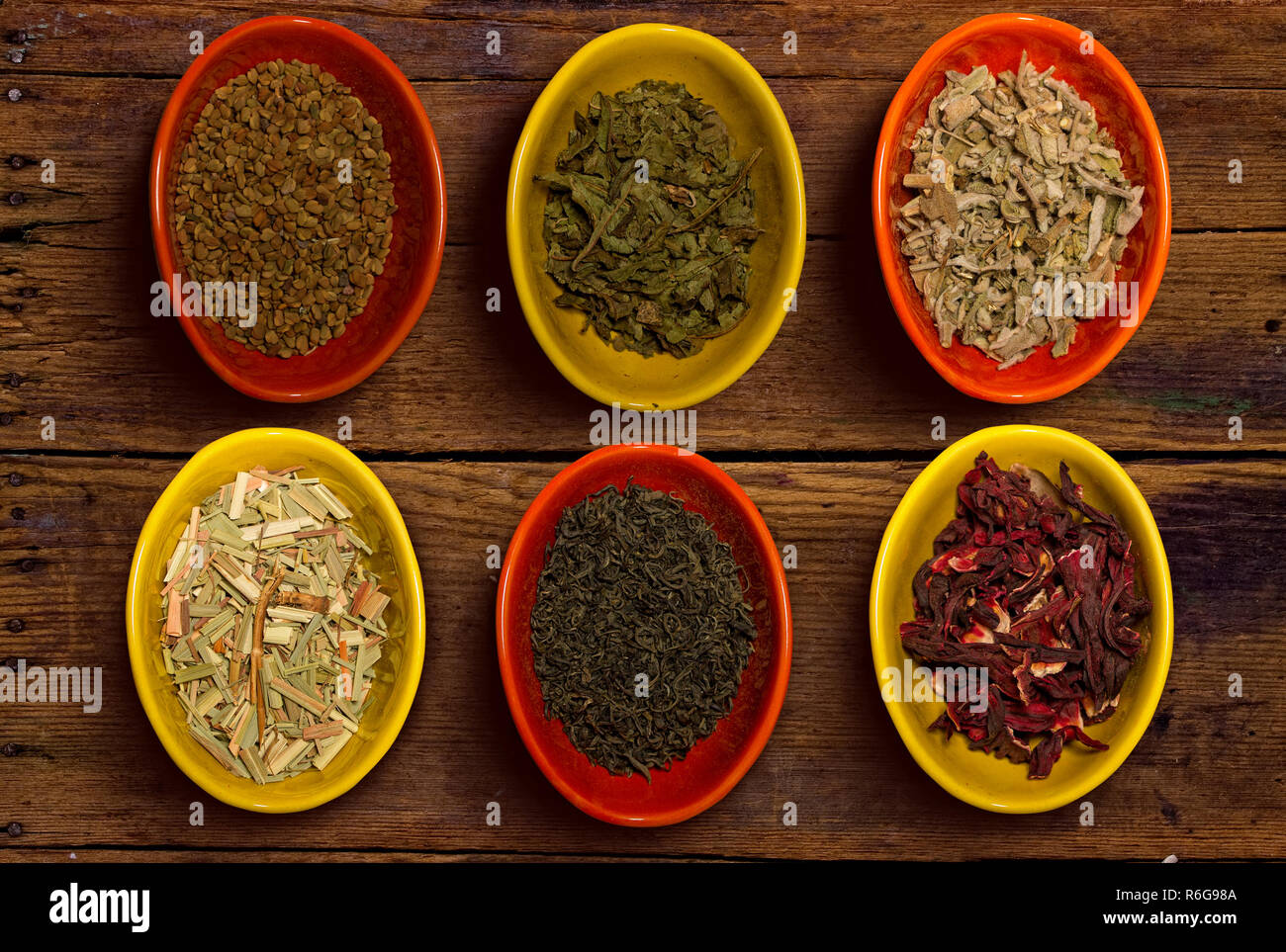 old rough wooden plank and several containers with different sorts of ...