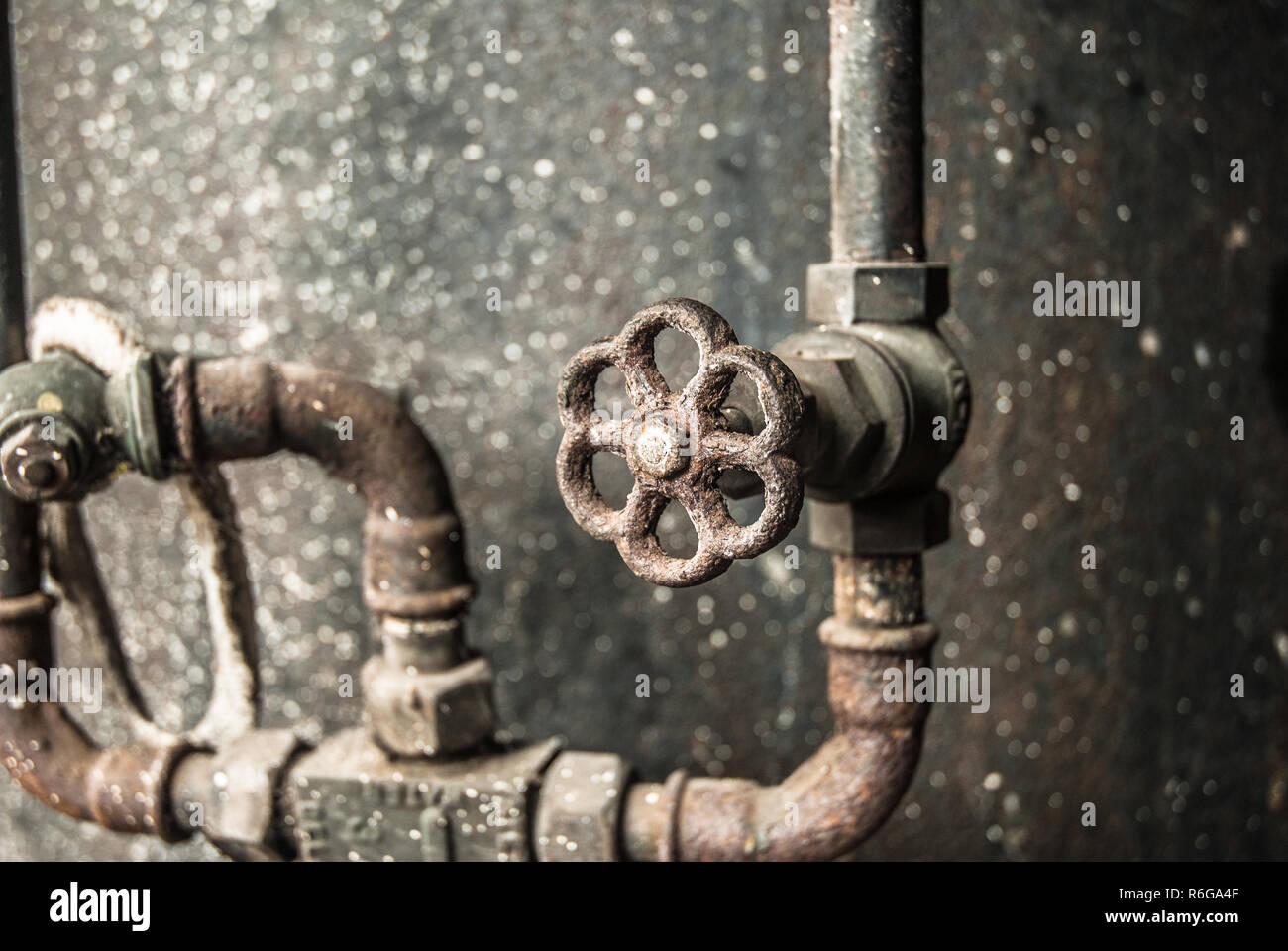 Old, rusty Industrial steam boiler tap Stock Photo - Alamy