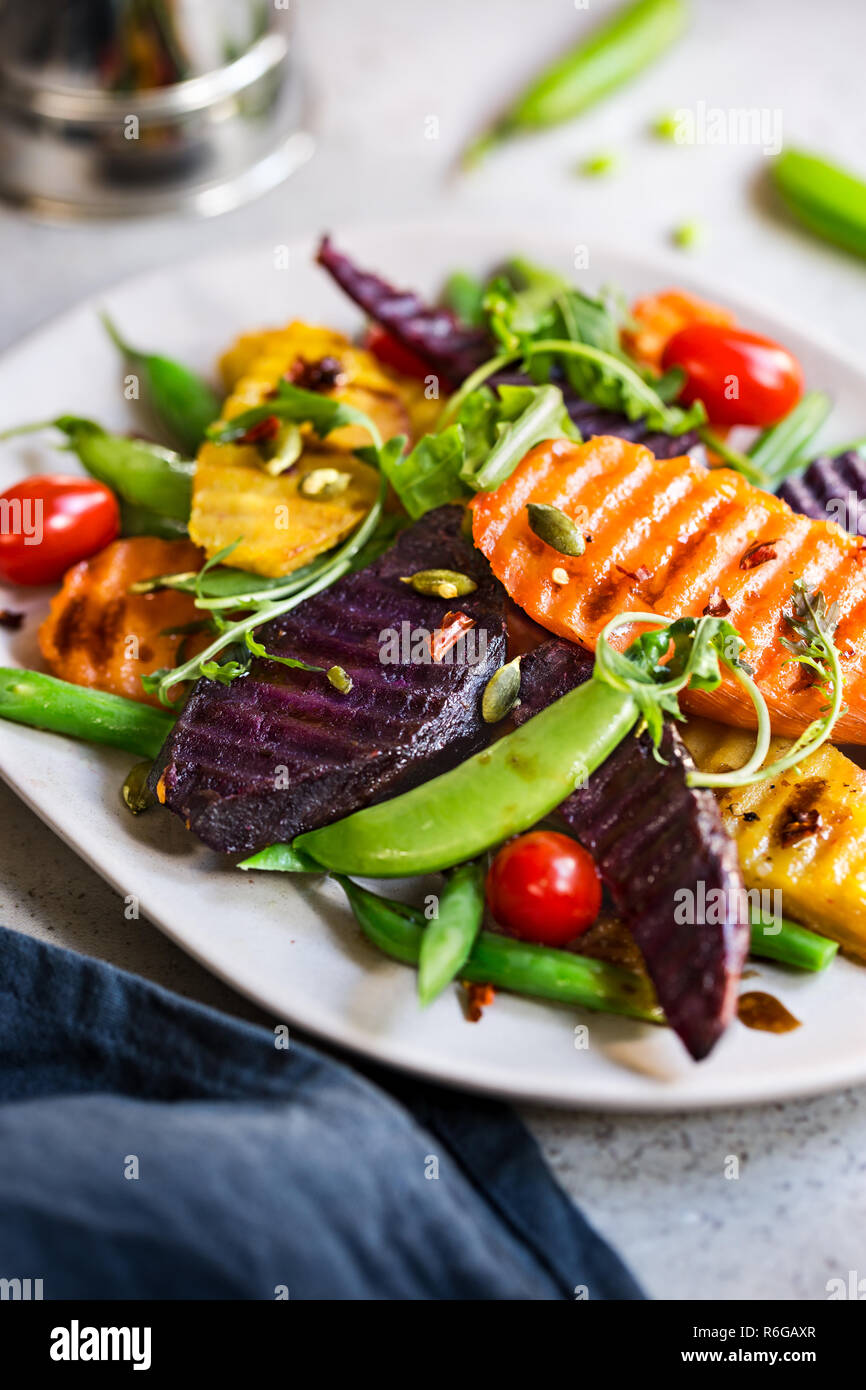 Grilled Sweet Potatoes with Snap pea and Rocket Stock Photo - Alamy