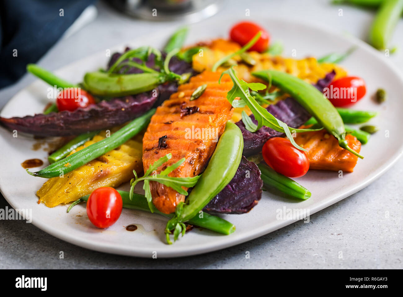 Grilled Sweet Potatoes with Snap pea and Rocket Stock Photo - Alamy