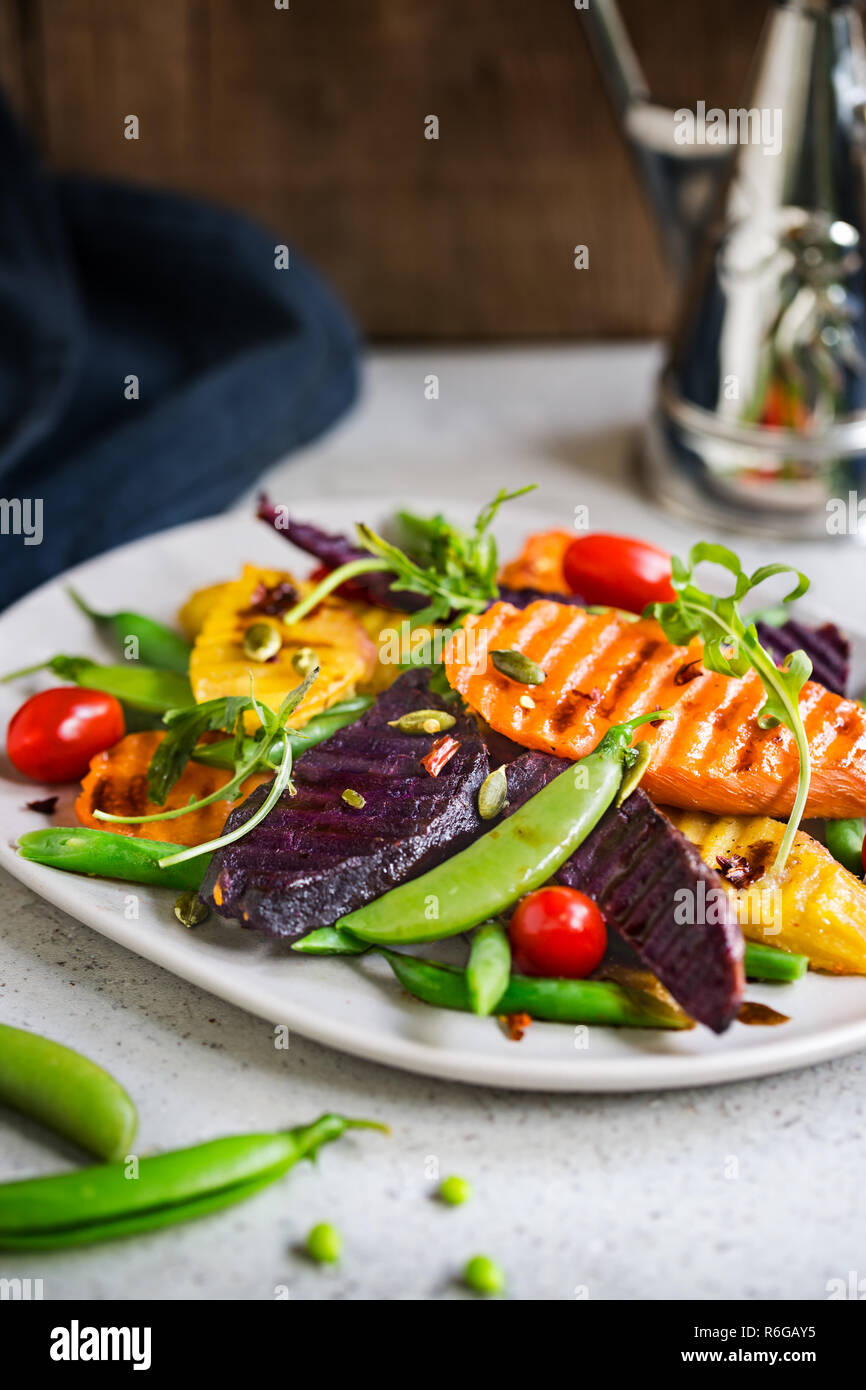 Grilled Sweet Potatoes with Snap pea and Rocket Stock Photo - Alamy