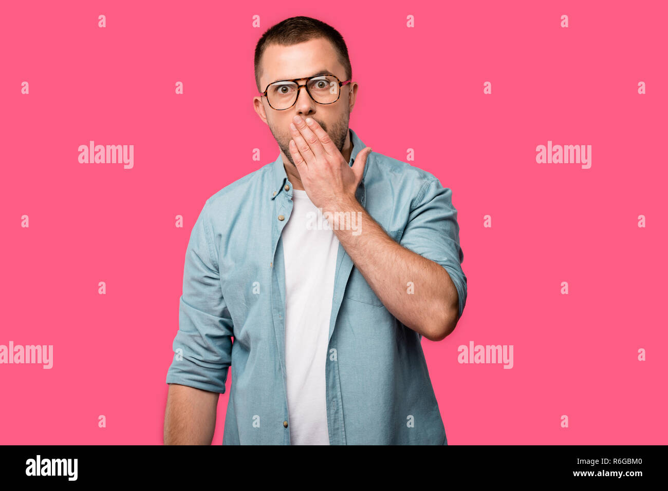 Man hand over mouth shocked hi-res stock photography and images - Alamy