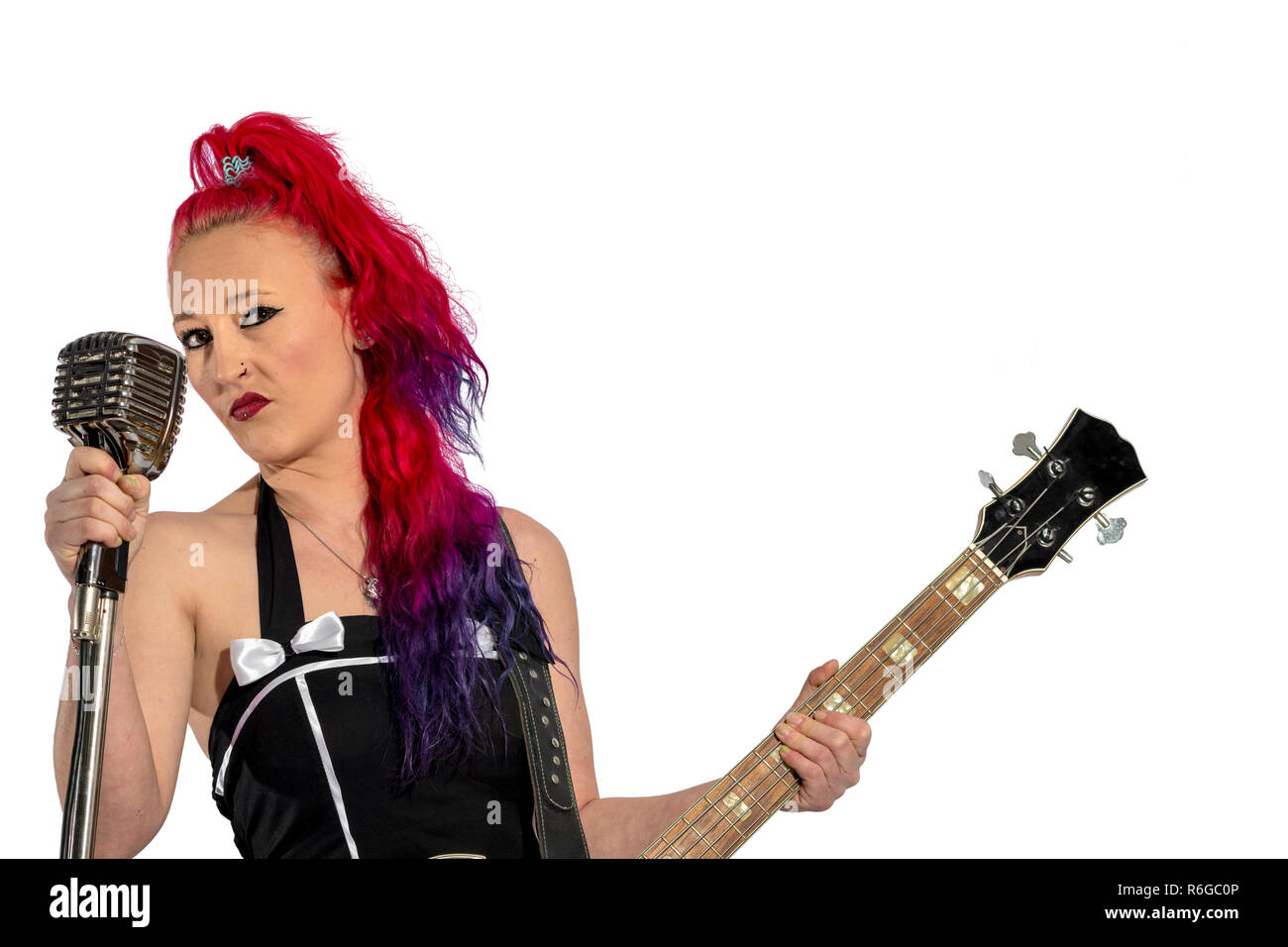 rock'n'roll singer with red hair,guitar and microphone Stock Photo - Alamy