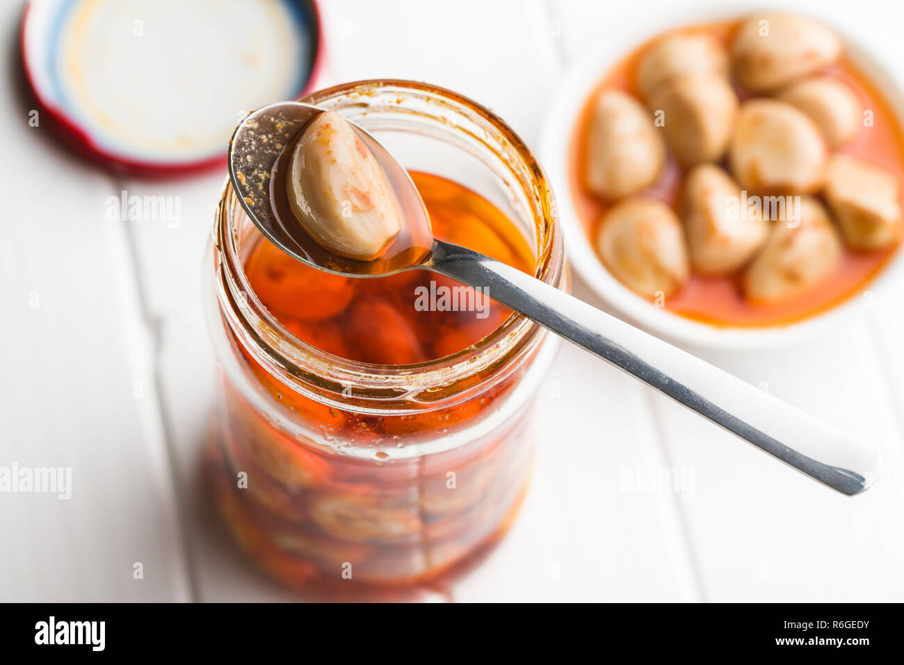 Tasty preserved garlic Stock Photo - Alamy