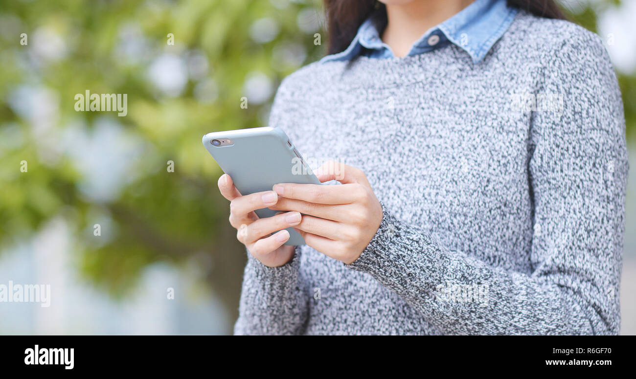 Woman use of smart phone at outdoor Stock Photo - Alamy