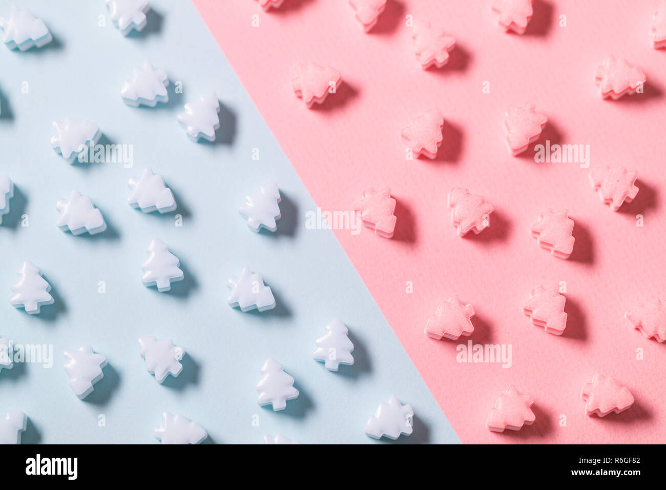 Christmas tree candy on pink and blue background Stock Photo - Alamy