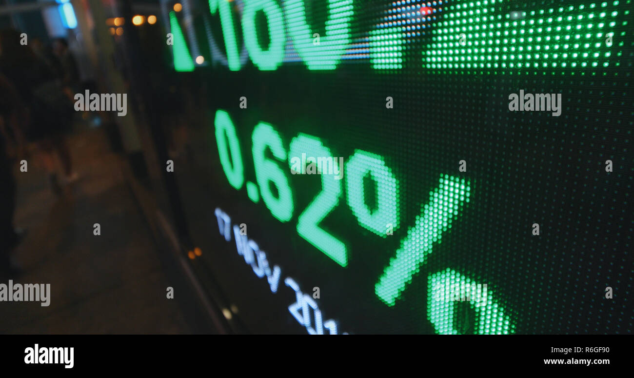 Stock market graph in city at night Stock Photo - Alamy
