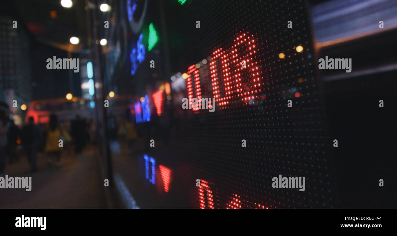 Stock market display in city at night Stock Photo - Alamy