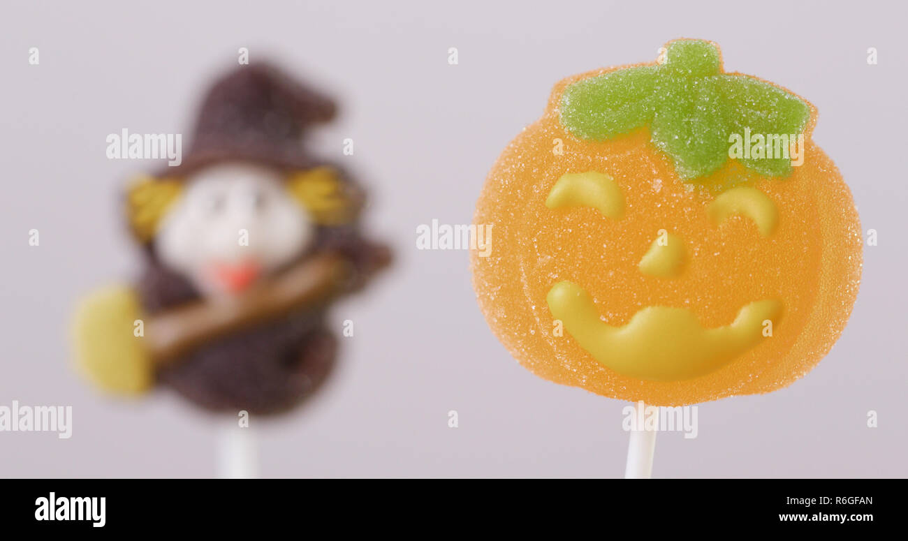 Halloween pumpkin candy lollipop Stock Photo - Alamy