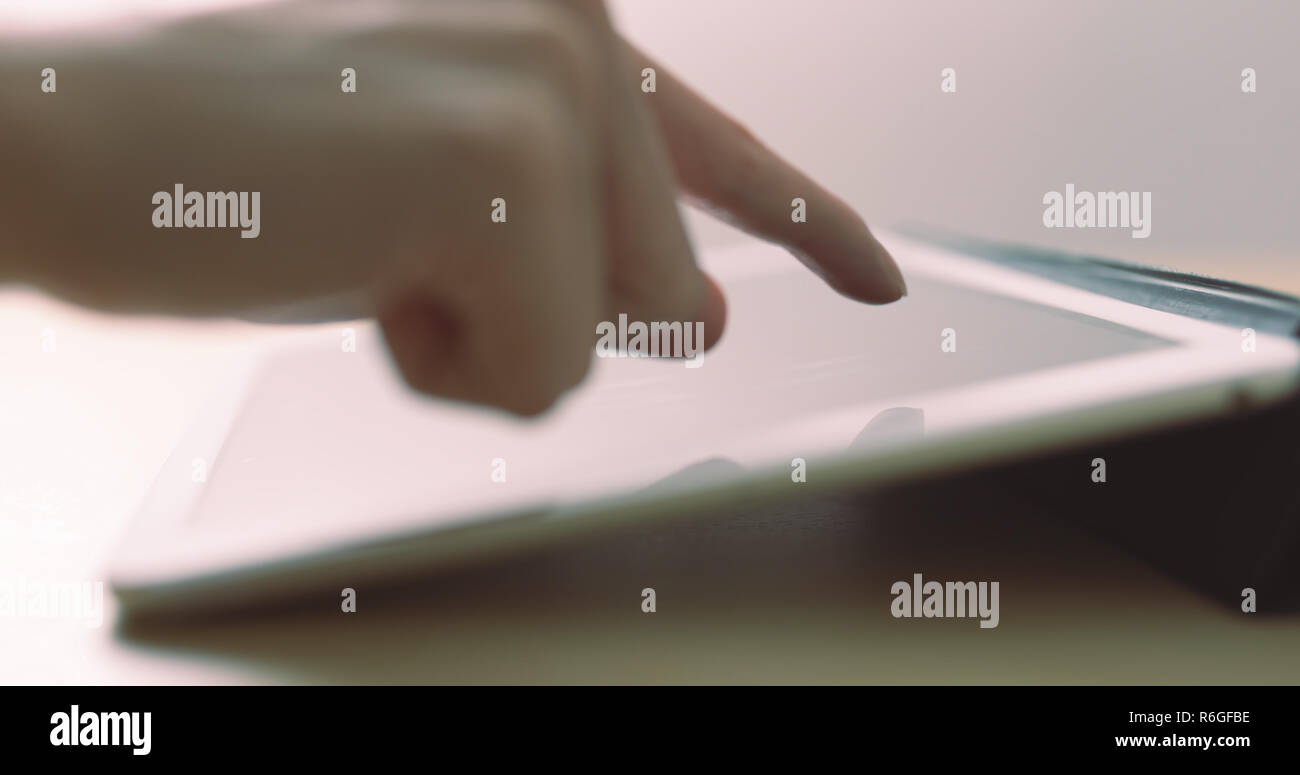 Finger touch on the screen of tablet computer Stock Photo - Alamy
