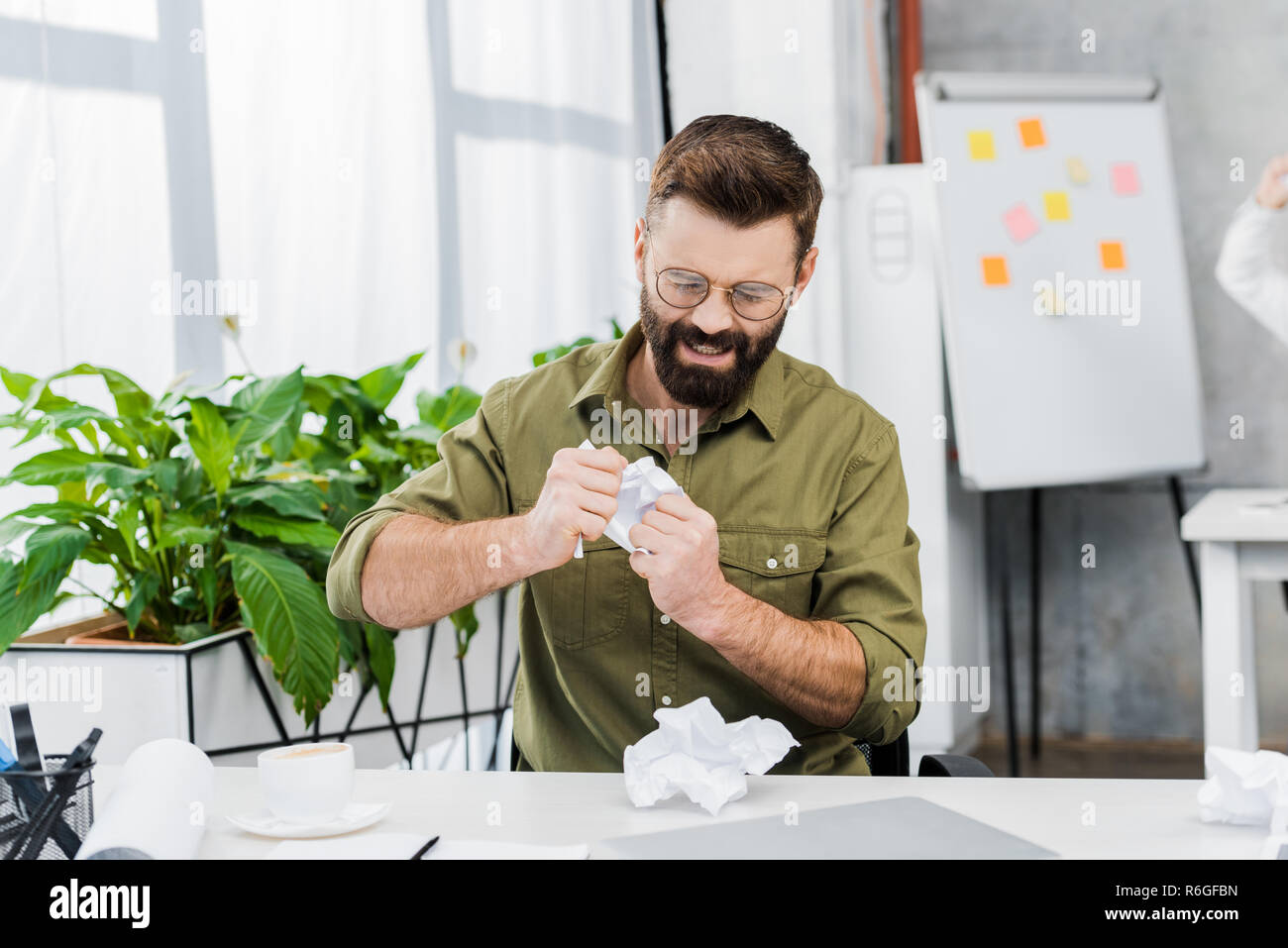 Angry businessman tearing paper hi-res stock photography and images - Alamy
