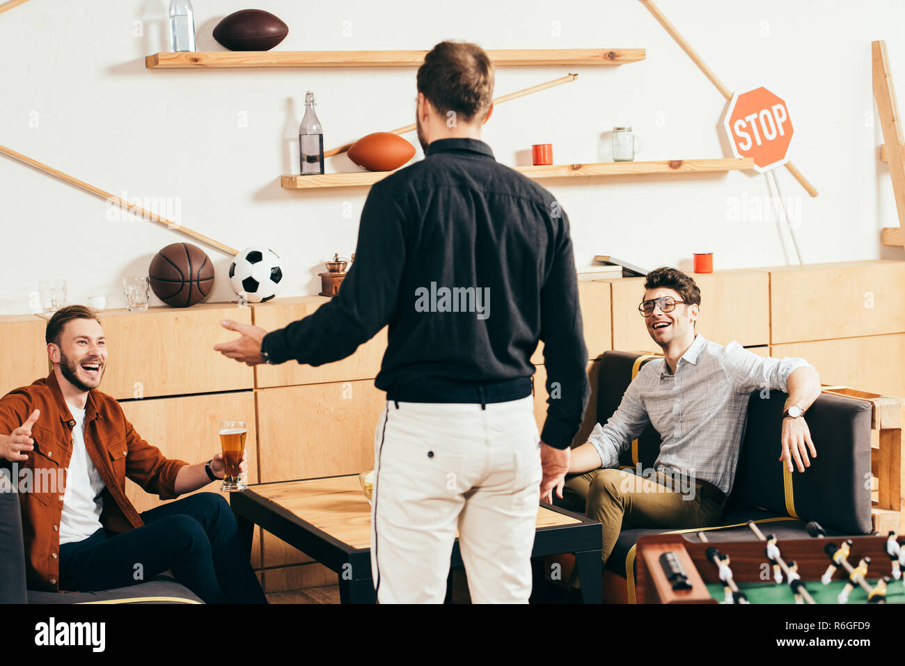 Greeting friends at cafe hi-res stock photography and images - Alamy