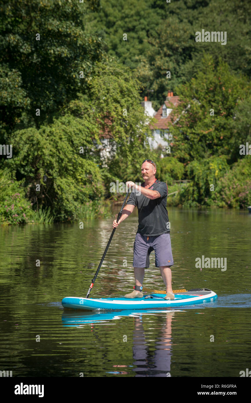 Man on paddleboard in a river hi-res stock photography and images - Alamy