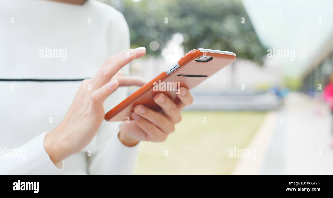 Woman look at mobile phone Stock Photo - Alamy