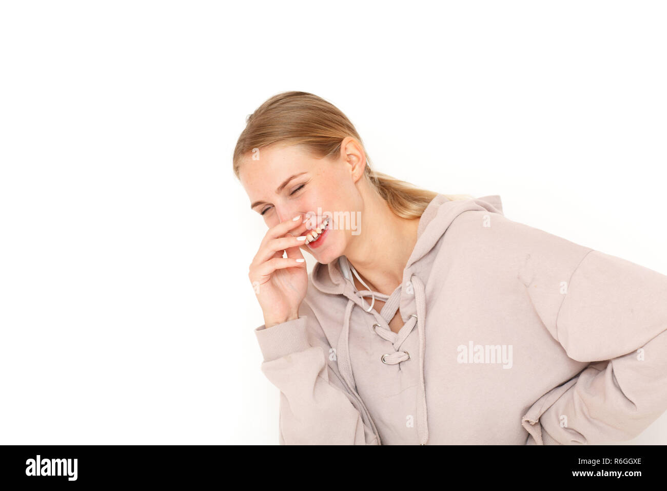 Portrait of laughing happy female model in white background Stock Photo ...