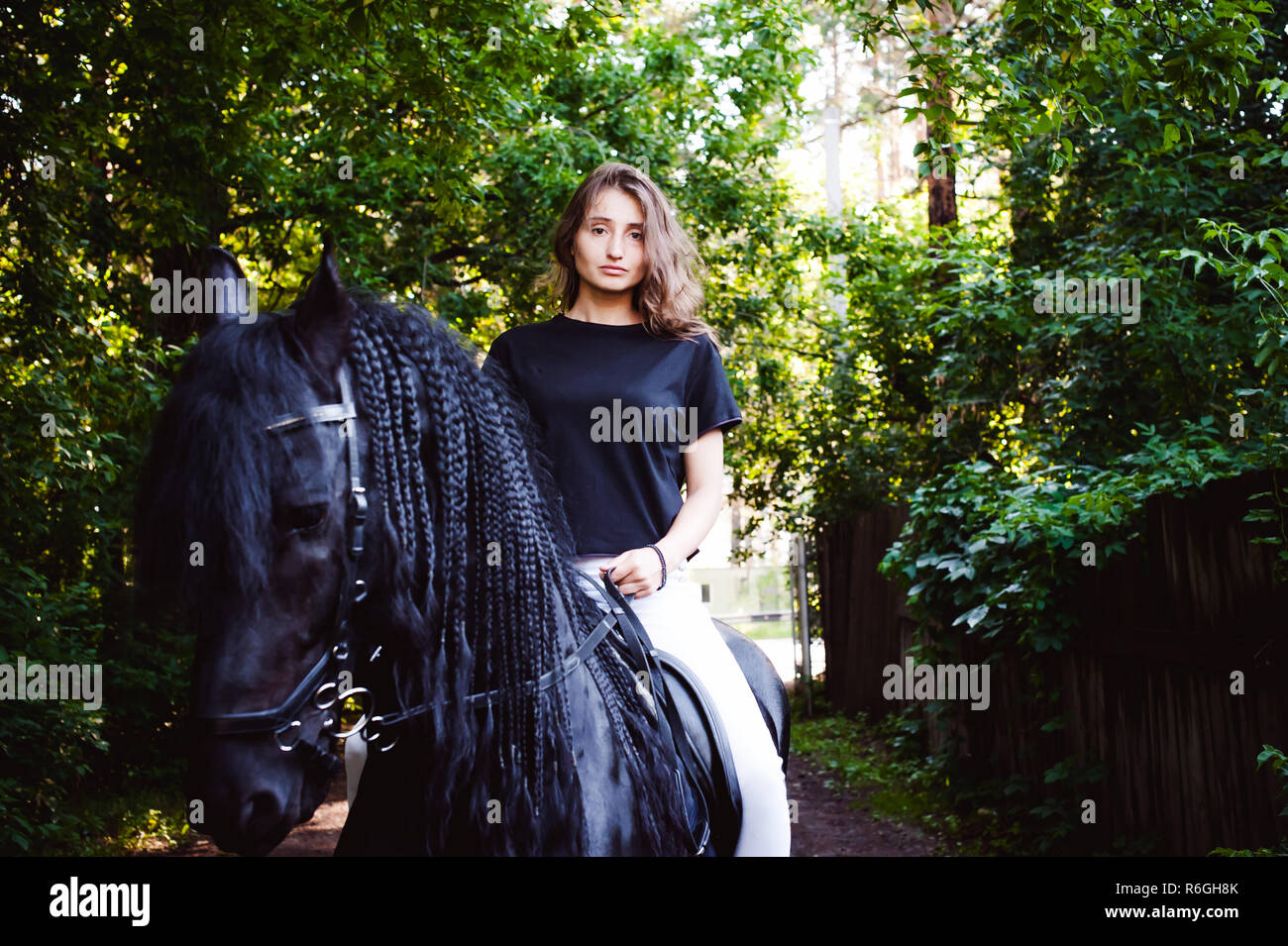 Emotional portrait of a horsewoman rider woman, astride, in love with ...