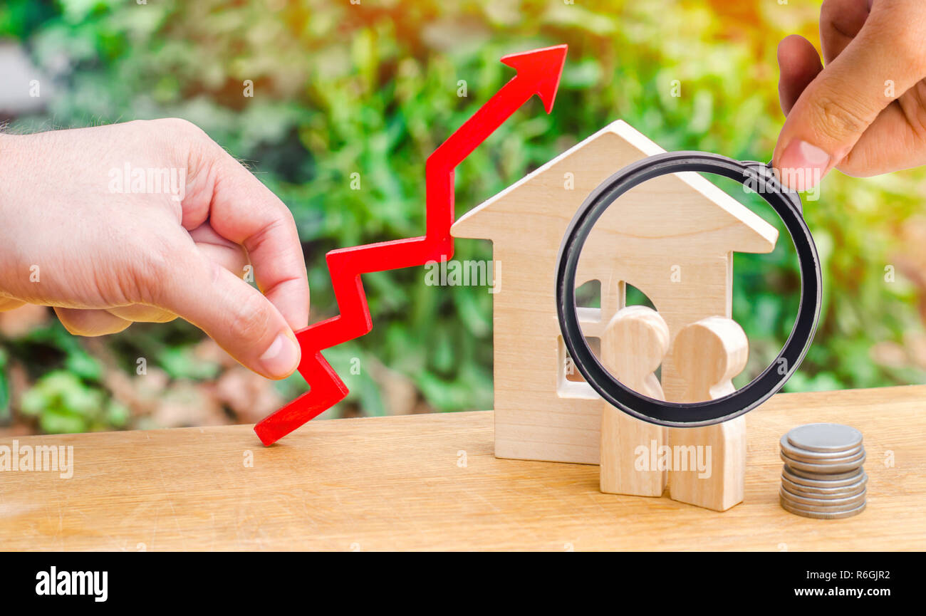 wooden house, money with a red arrow up. concept of high demand for ...