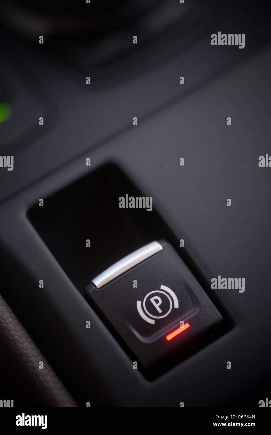 Car parking brake button Stock Photo - Alamy