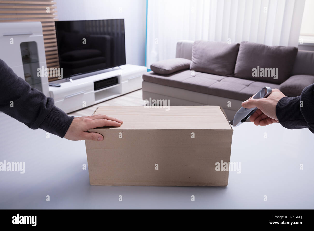 Hand opening packet hi-res stock photography and images - Alamy