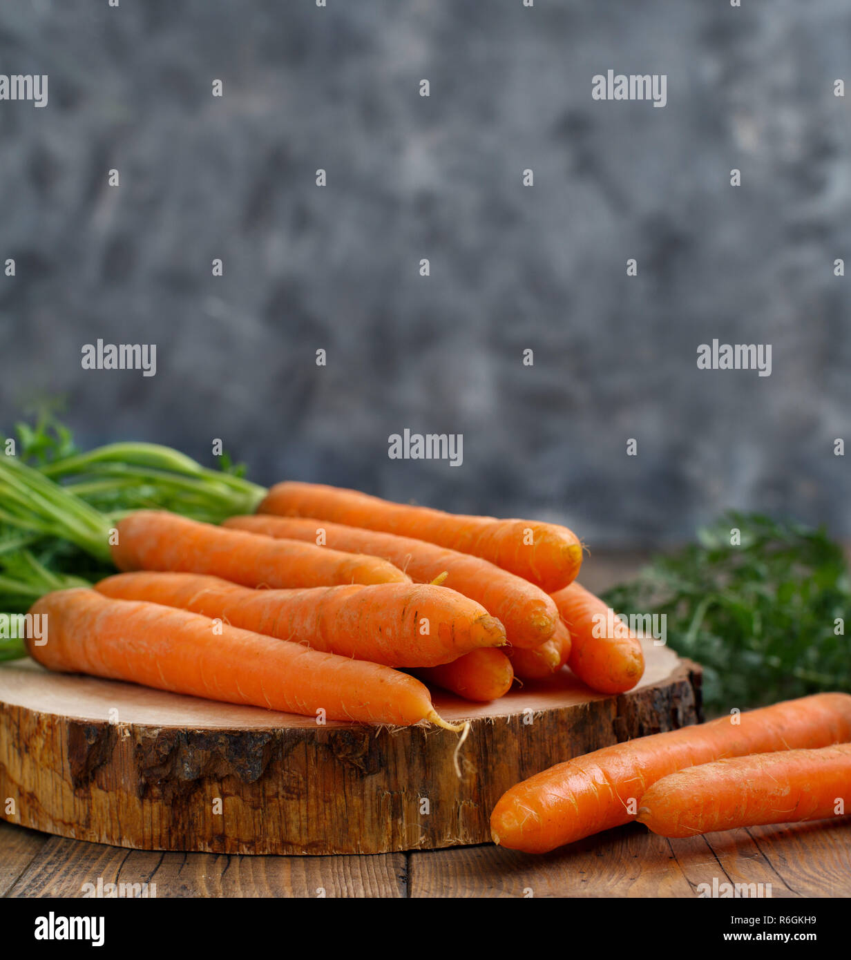 Fresh raw carrots with leaves Stock Photo - Alamy