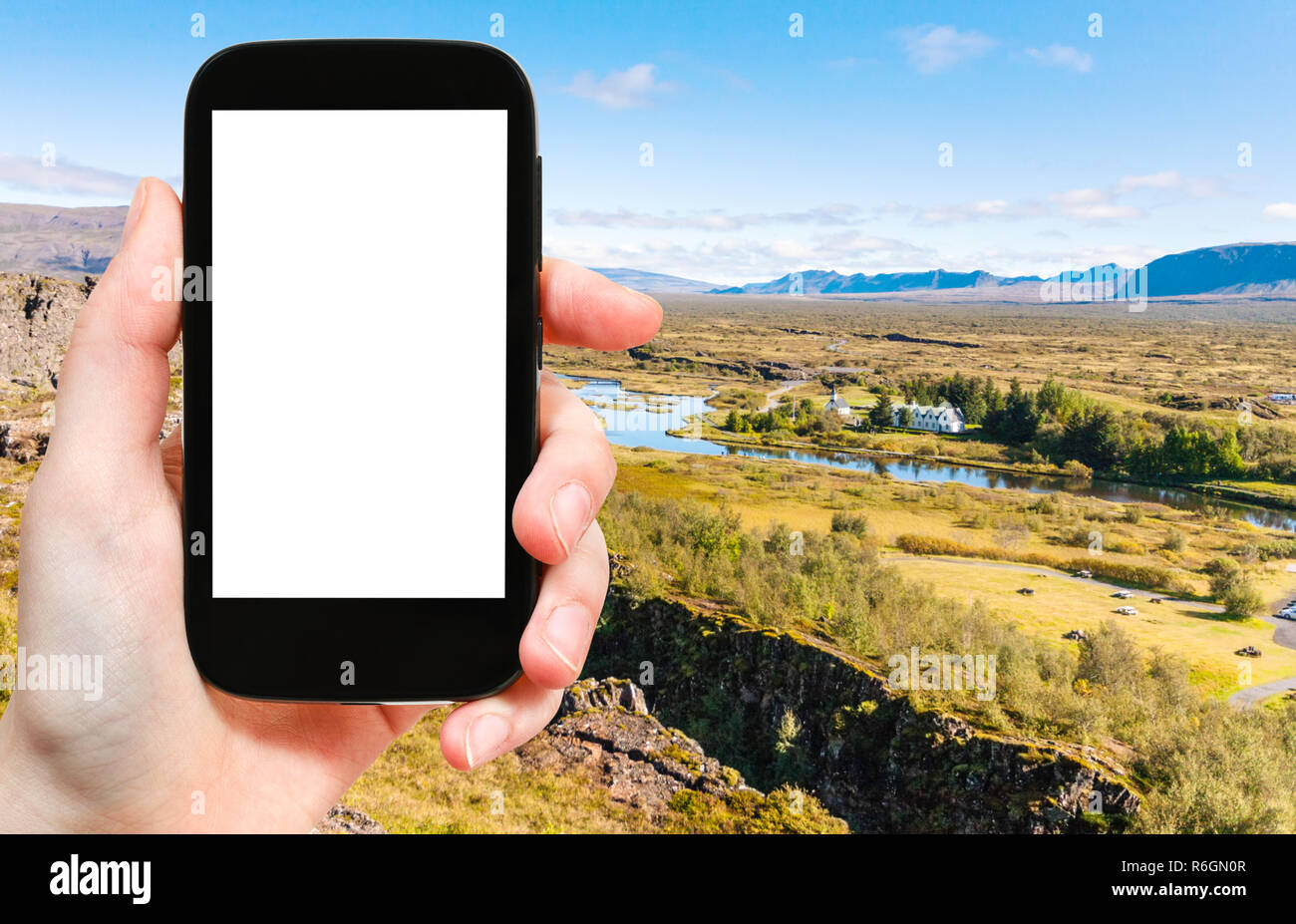 tourist photographs rift valley in Thingvellir Stock Photo - Alamy
