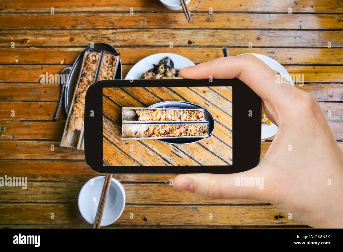 tourist photographs local chinese fried rice Stock Photo - Alamy