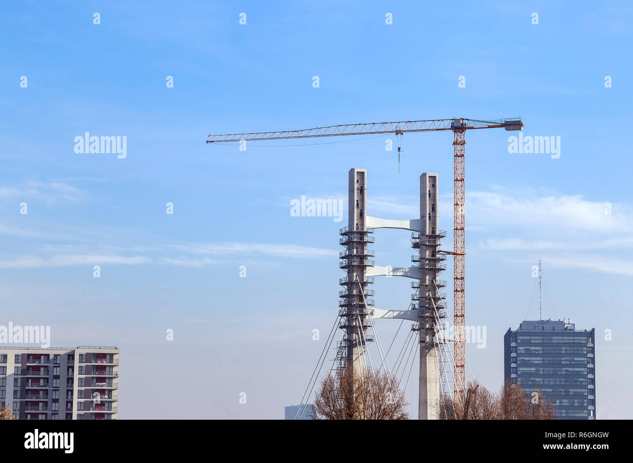 Concrete bridge under construction. Pillars supporting road bridge ...