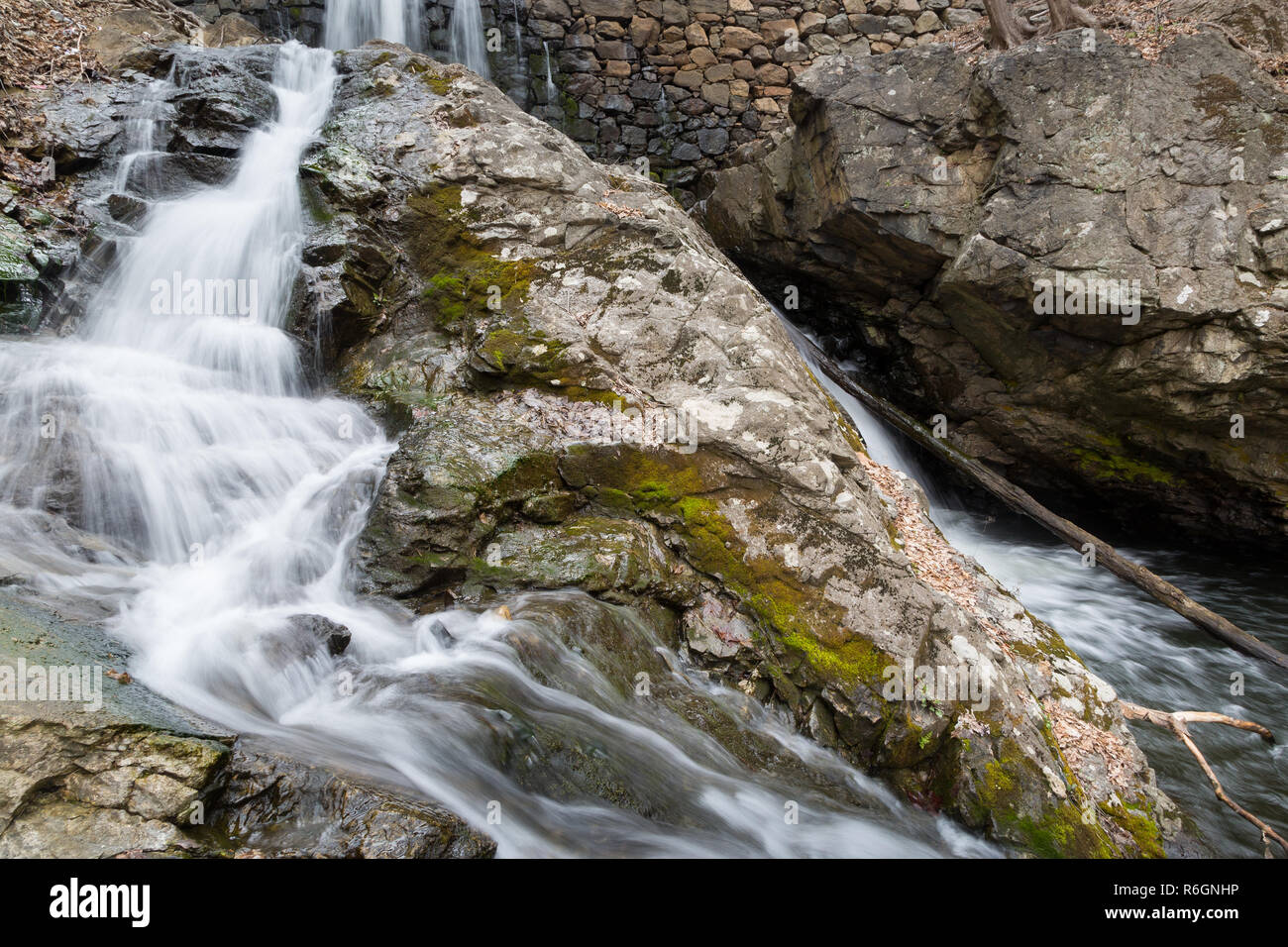 A waterfall along Foundry Brook pouring over rocks and boulders. West ...