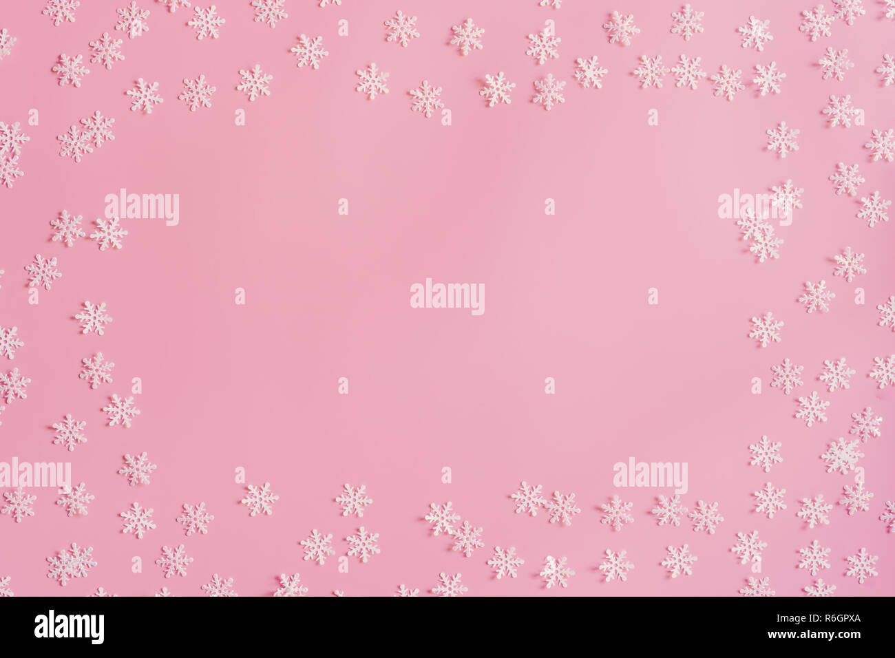Top view Christmas snowflake border frame on pink background. Xmas ...