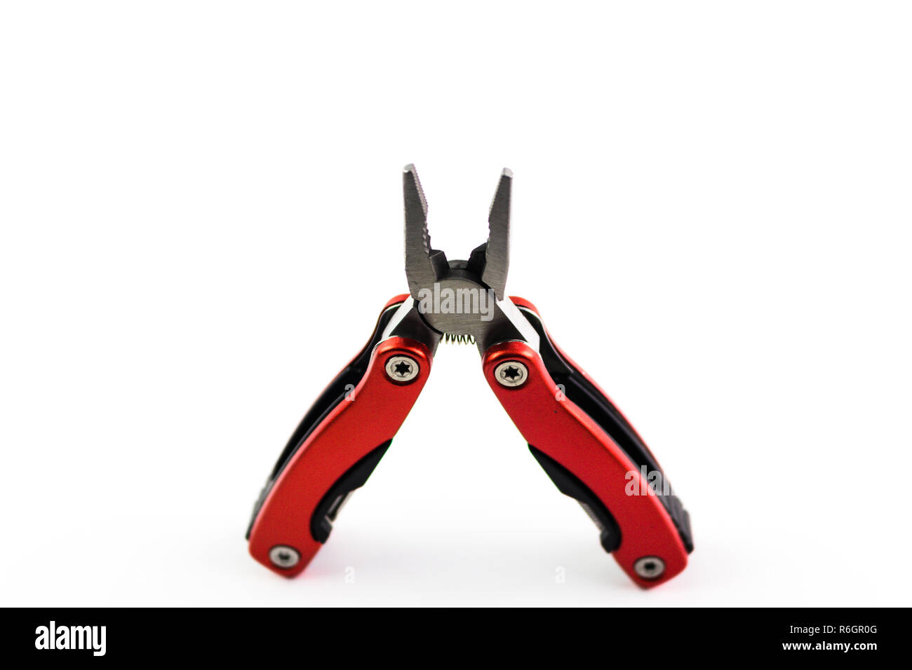 Silver metal Pliers with red handle Stock Photo - Alamy