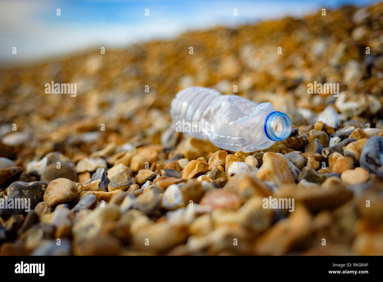 Beach pollution, plastic and waste from the ocean on a beach Stock ...