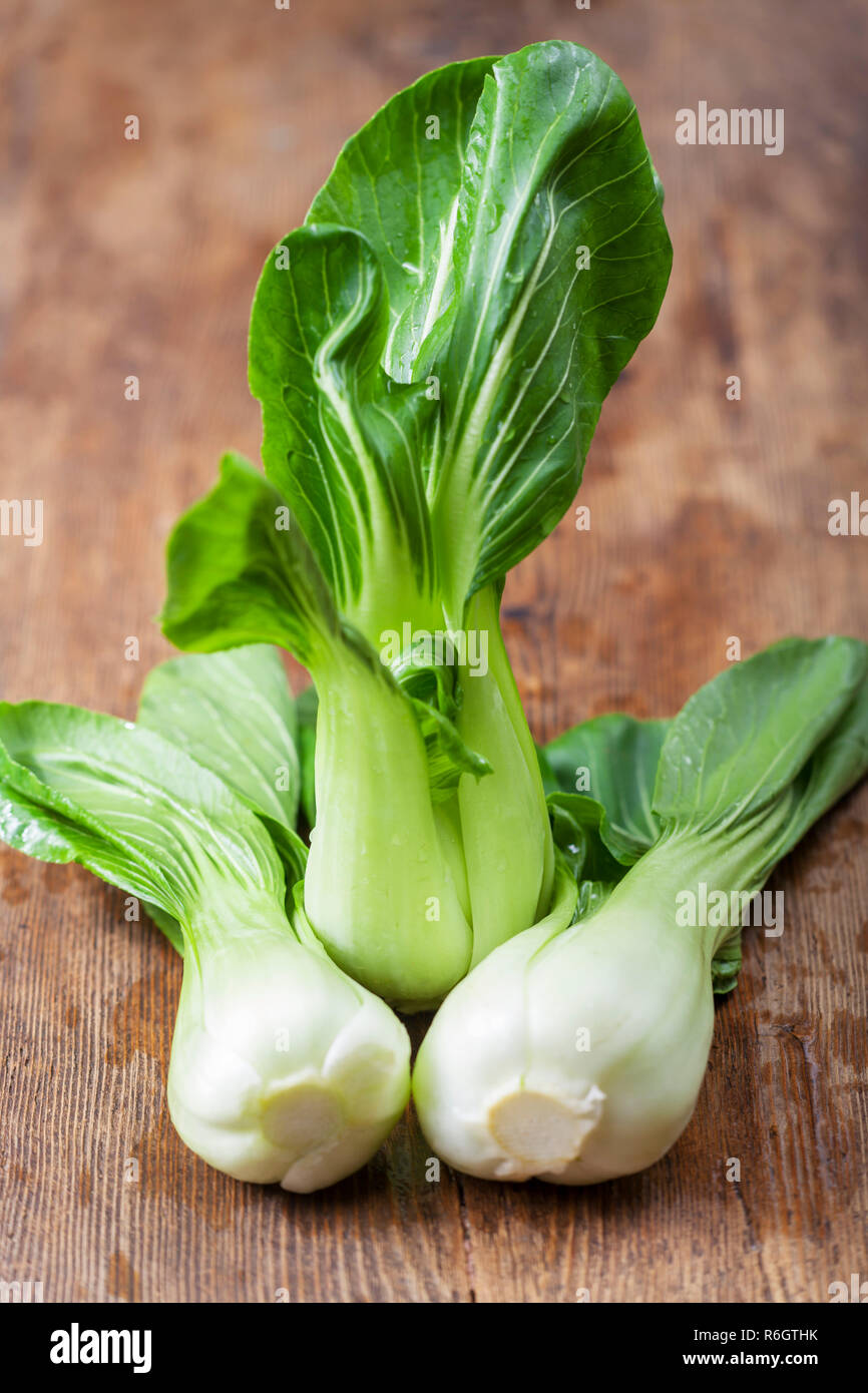 asian pak choi on dark wood Stock Photo - Alamy
