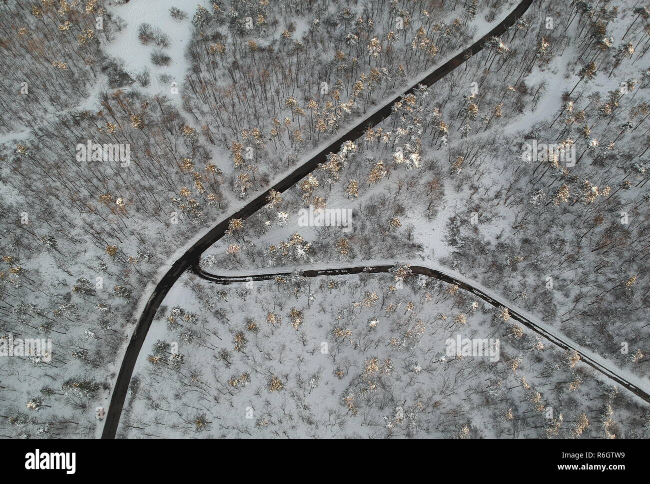 Aerial view of winding road in winter Stock Photo - Alamy