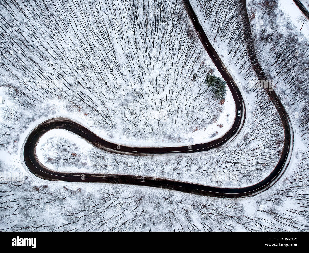 Aerial view of winding road in winter Stock Photo - Alamy