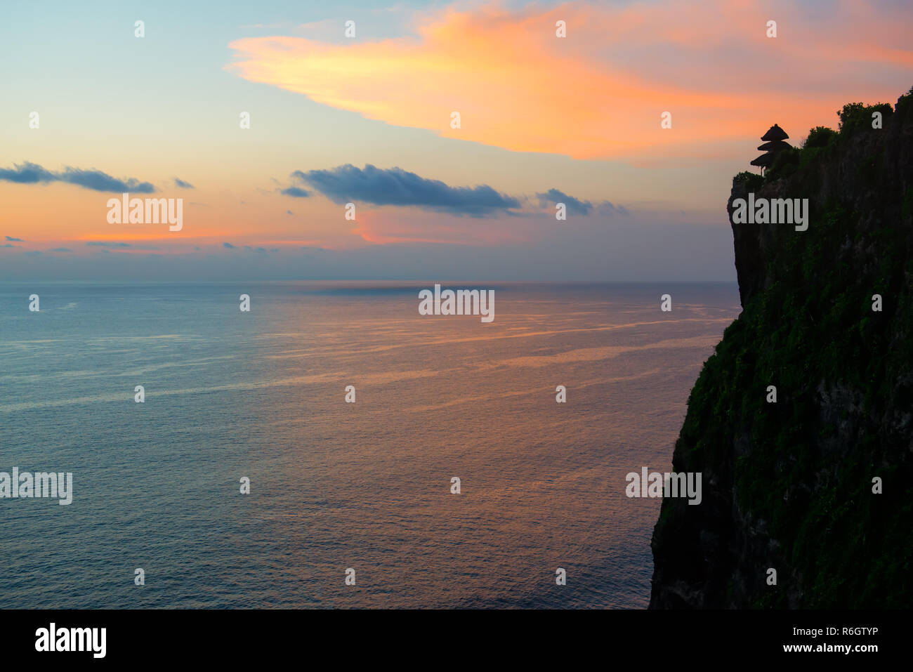 Bali sunset at Uluwatu temple Stock Photo - Alamy