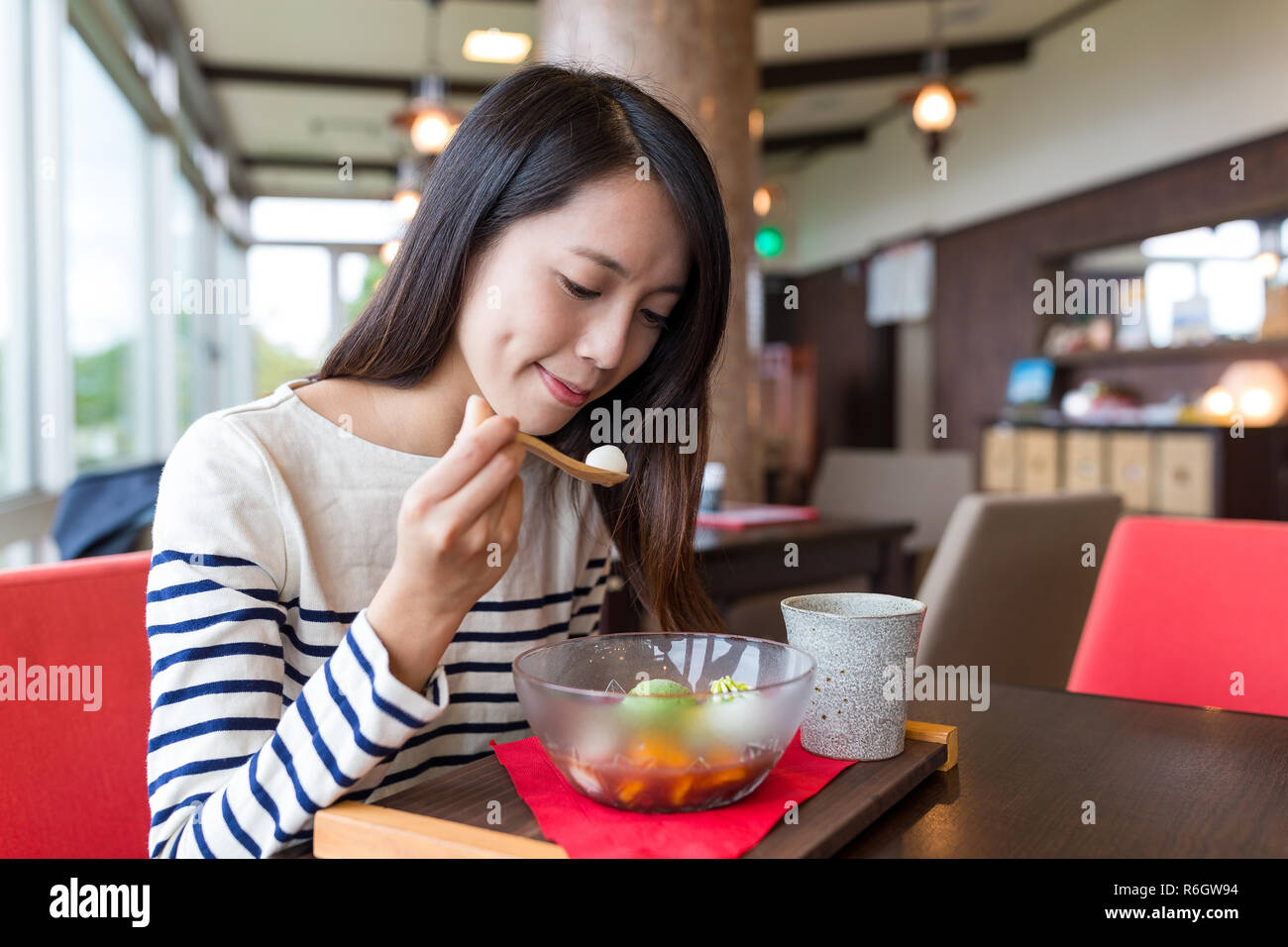 Woman enjoy her dessert in coffee shop Stock Photo - Alamy