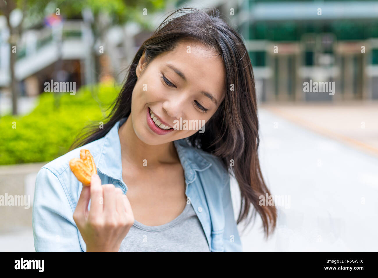 Woman enjoy Palmier in city Stock Photo - Alamy