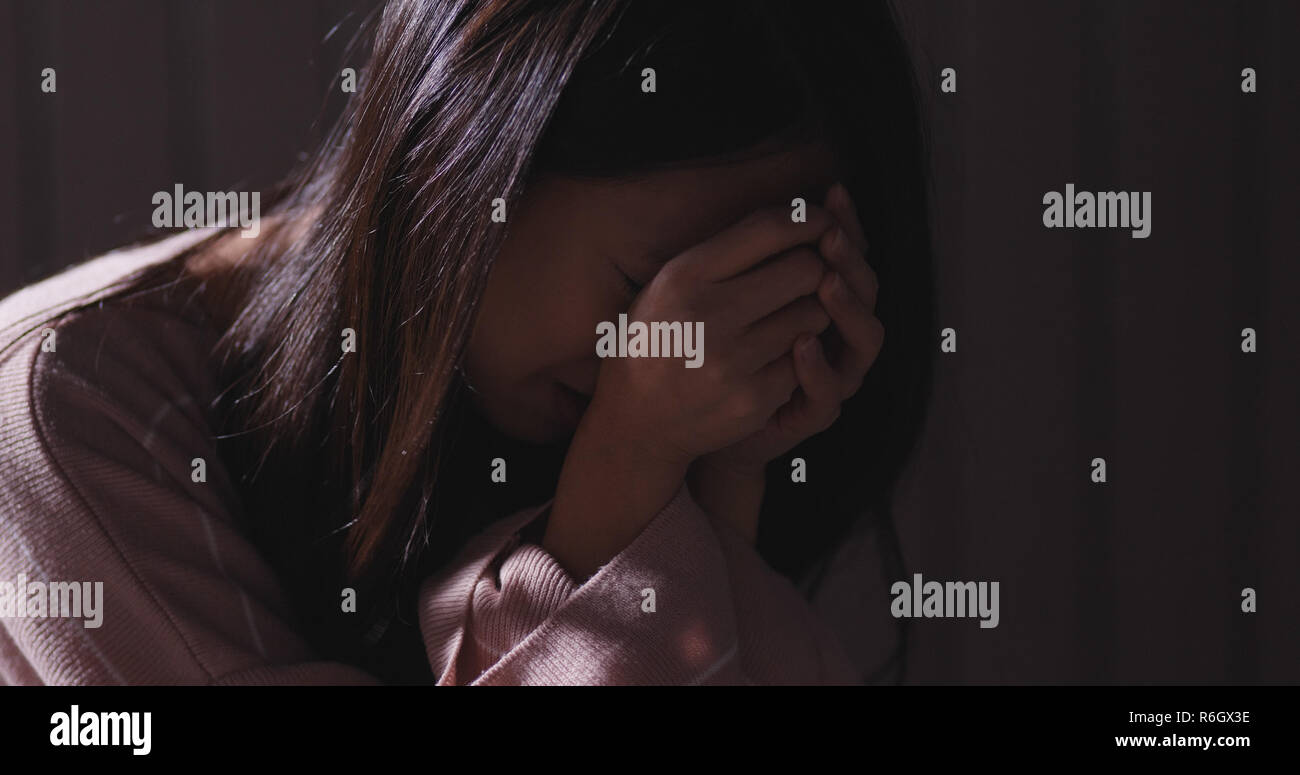 Woman crying in the dark Stock Photo - Alamy