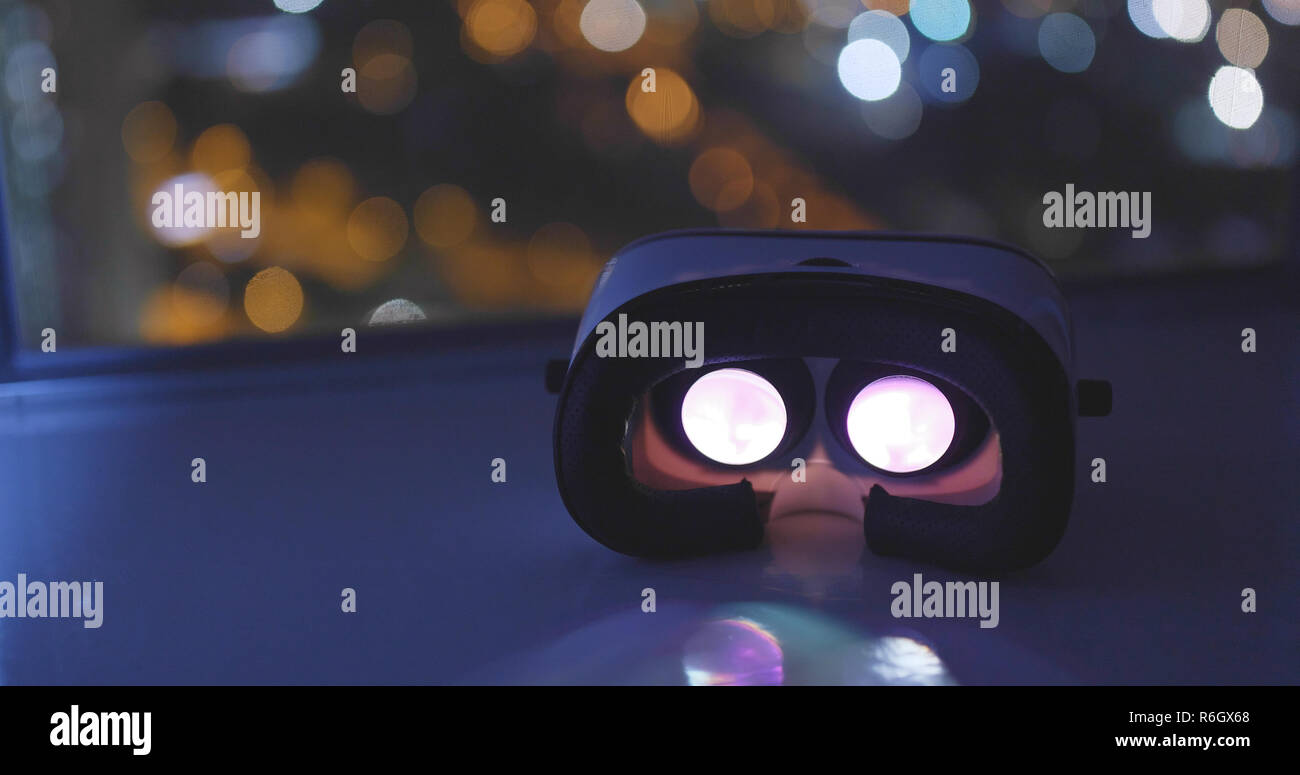 Virtual reality device at night Stock Photo - Alamy
