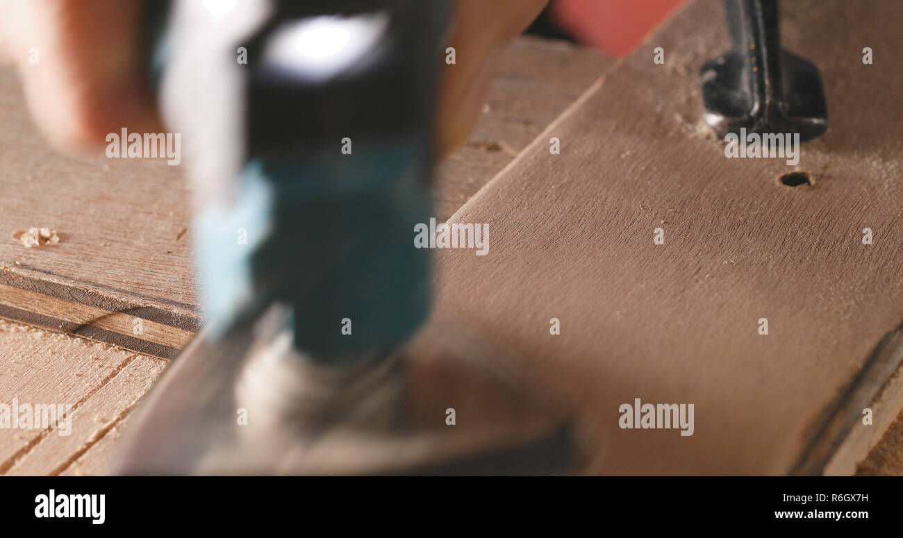 Wood grinder by electric hand router Stock Photo - Alamy