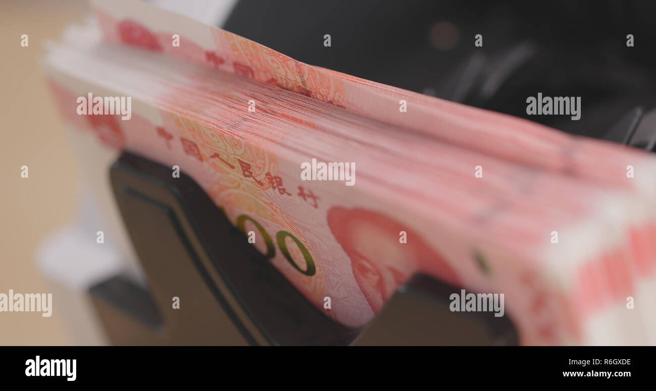 Counting money machine calculate the number of RMB Stock Photo - Alamy