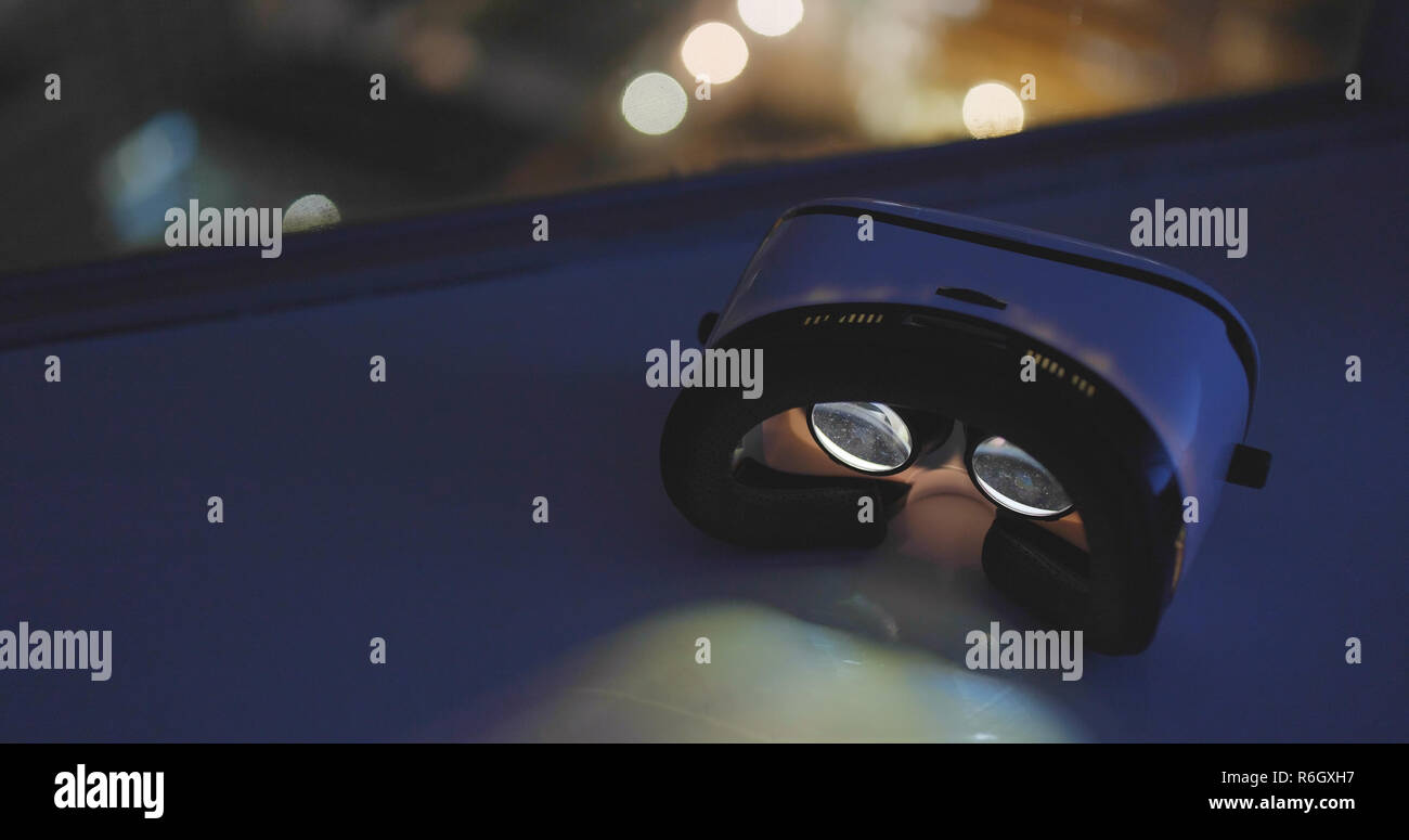 Virtual reality device playing music video inside with city background ...