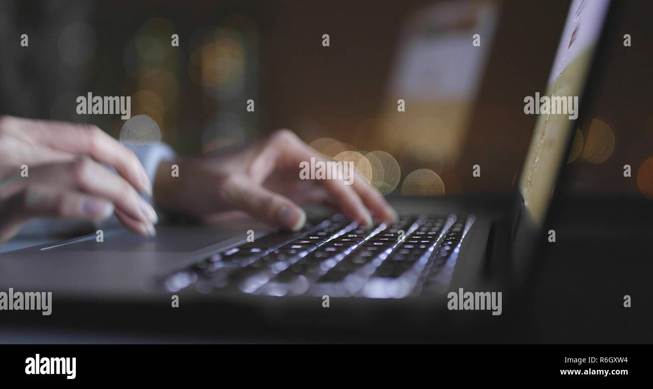 Working on laptop computer at night Stock Photo - Alamy
