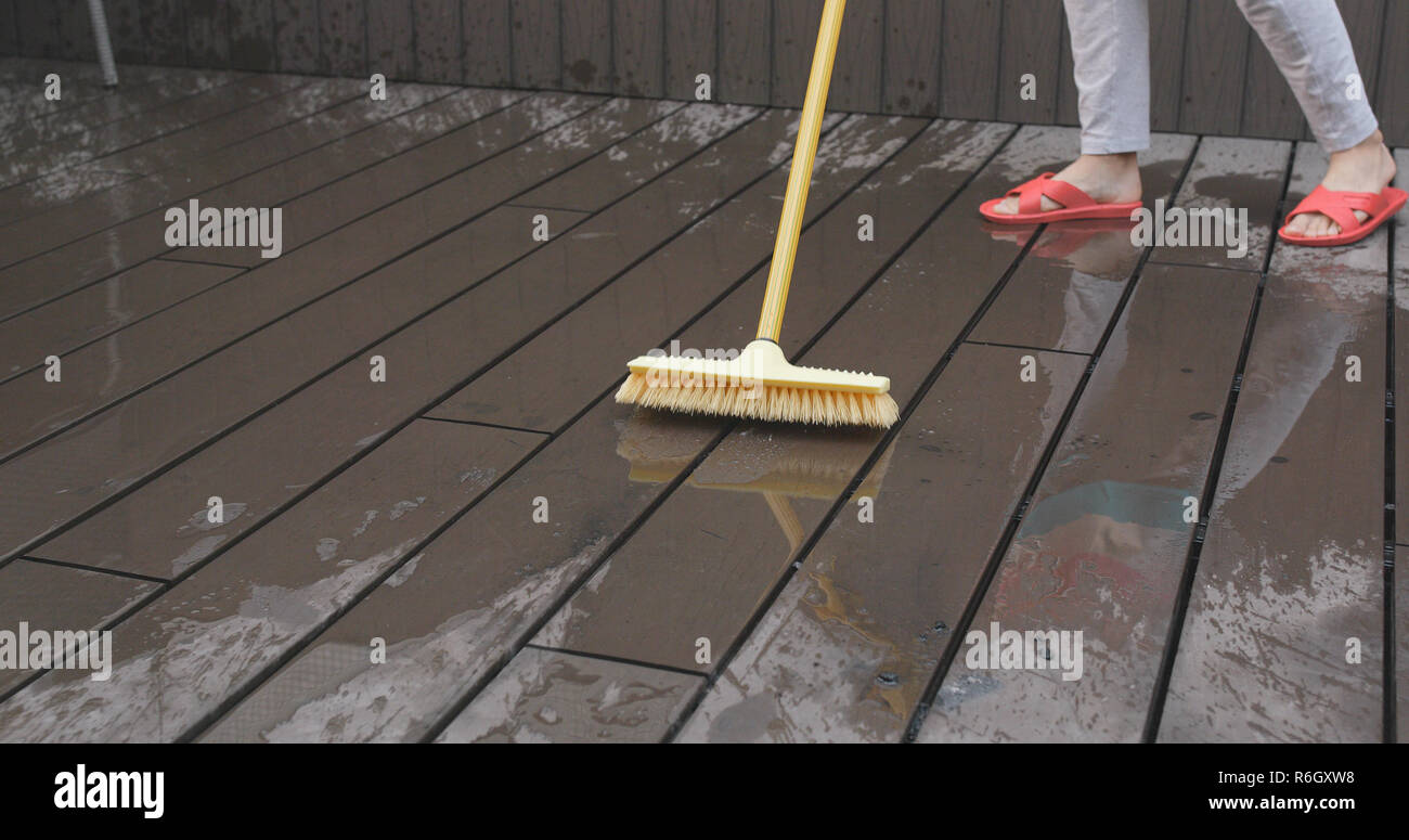 Cleaning the floor with brush Stock Photo - Alamy