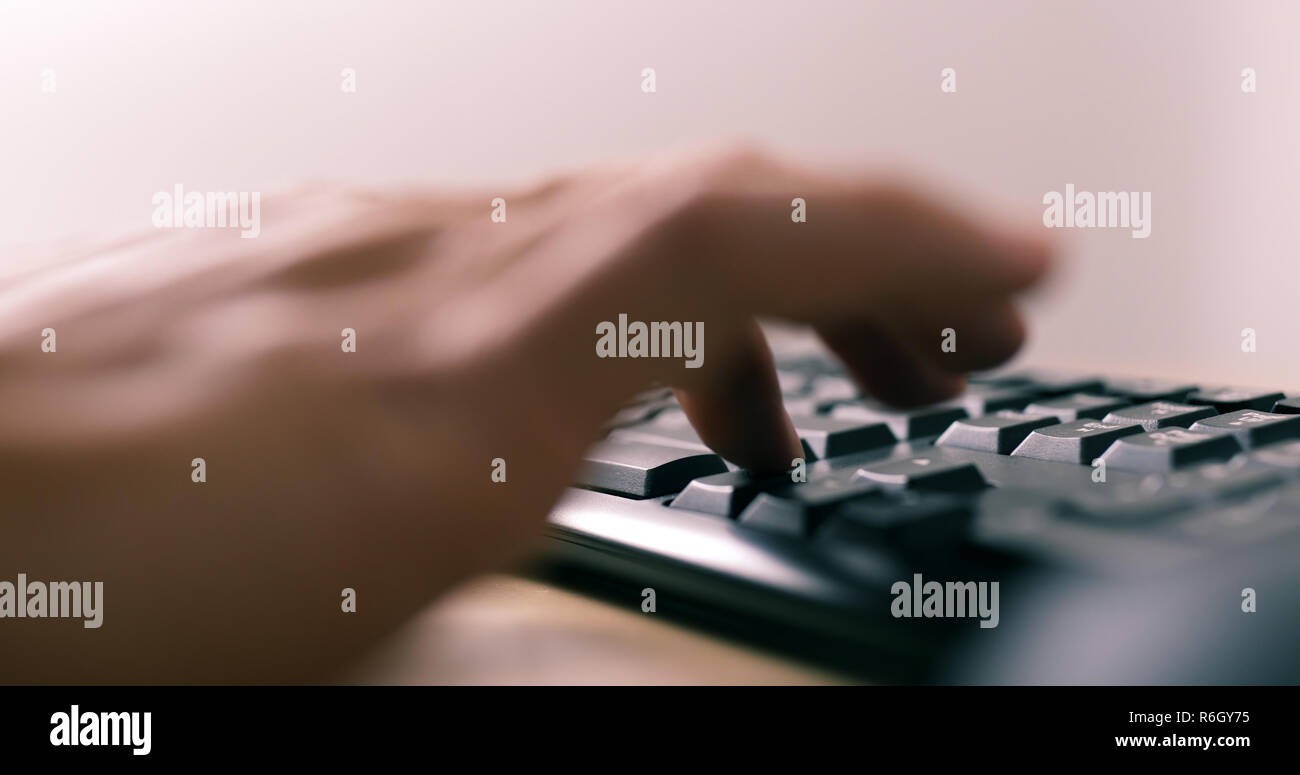 Typing on keyboard Stock Photo - Alamy