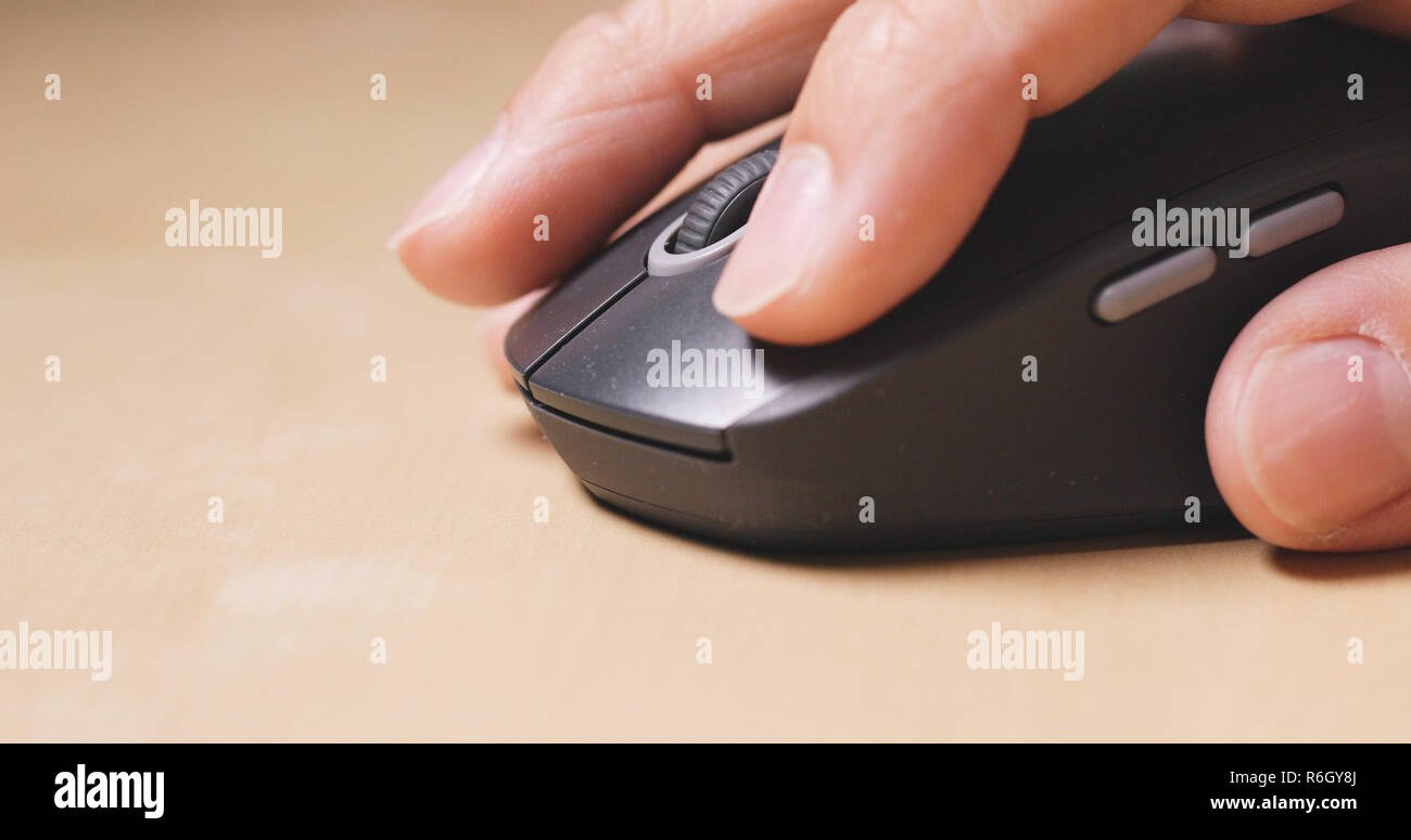 Man uses a computer mouse Stock Photo - Alamy